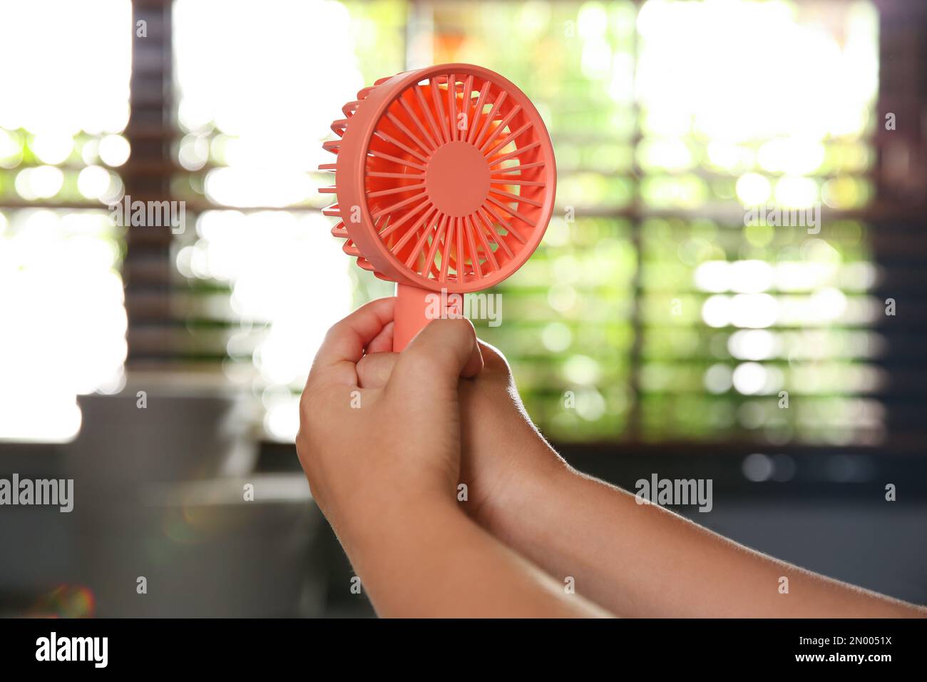 Little child with portable fan at home, closeup. Summer heat Stock ...