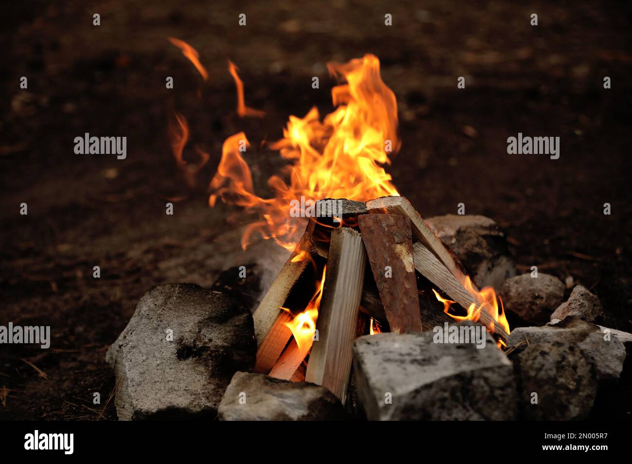 Beautiful bonfire with pile of burning firewood outdoors Stock Photo ...