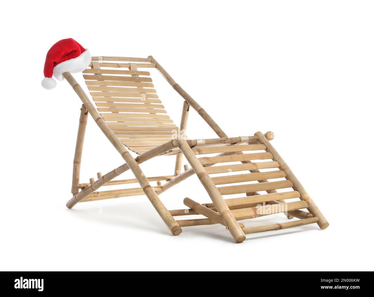 Wooden deck chair and Santa Claus hat on white background. Christmas ...