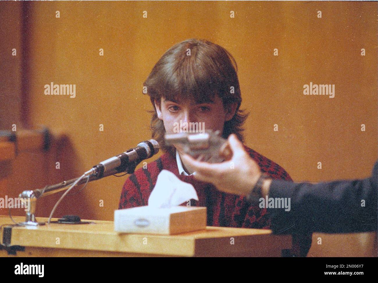 FILE - In this March 12, 1991 file photo, William Flynn is shown the ...