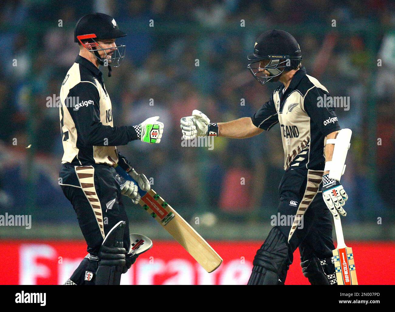 New Zealand's Colin Munro, left, and Kane Williamson celebrate while ...