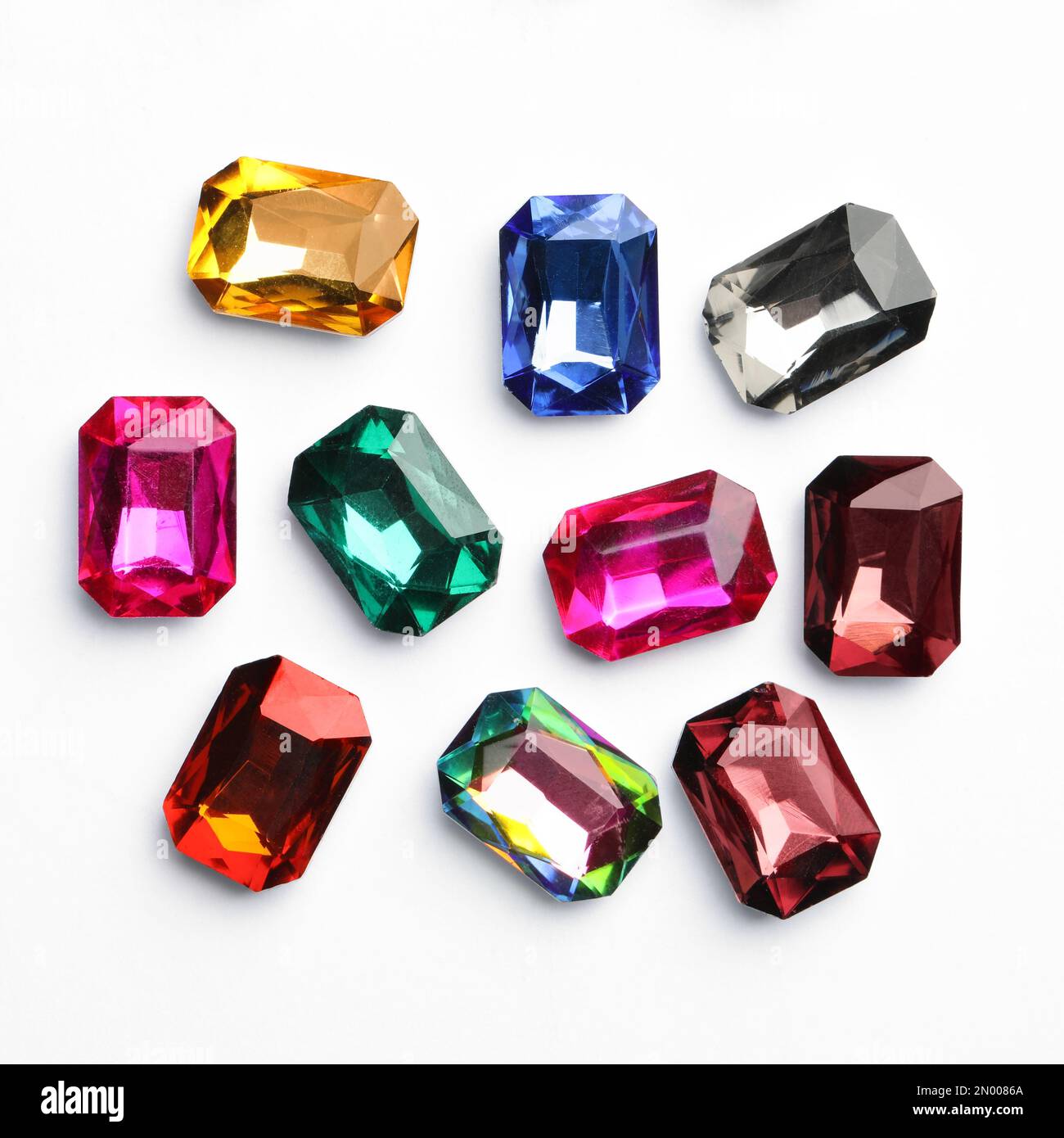 Different beautiful gemstones on white background, top view Stock Photo ...