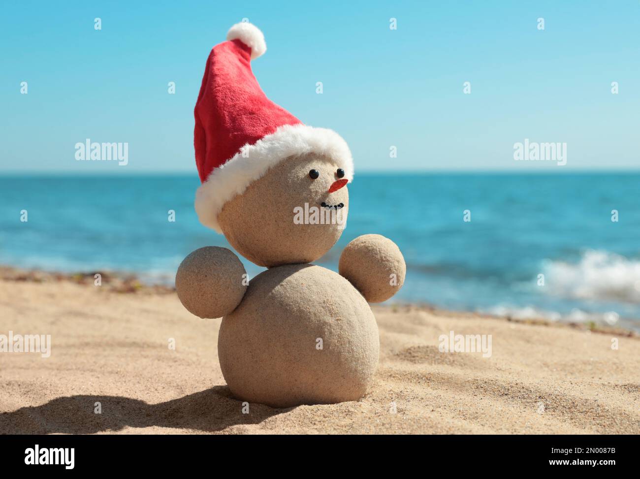 Snowman made sand on beach hi-res stock photography and images - Alamy