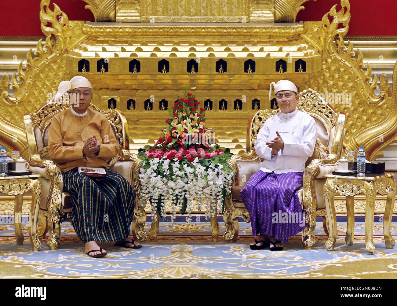 Myanmar's new president Htin Kyaw, left, is seated with outgoing ...