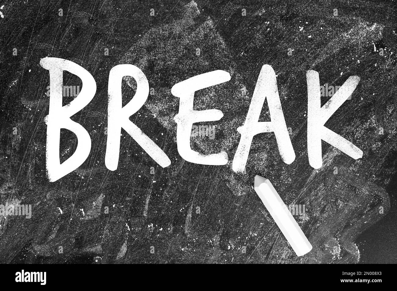 Word Break and chalk on black chalkboard, top view. School holidays ...