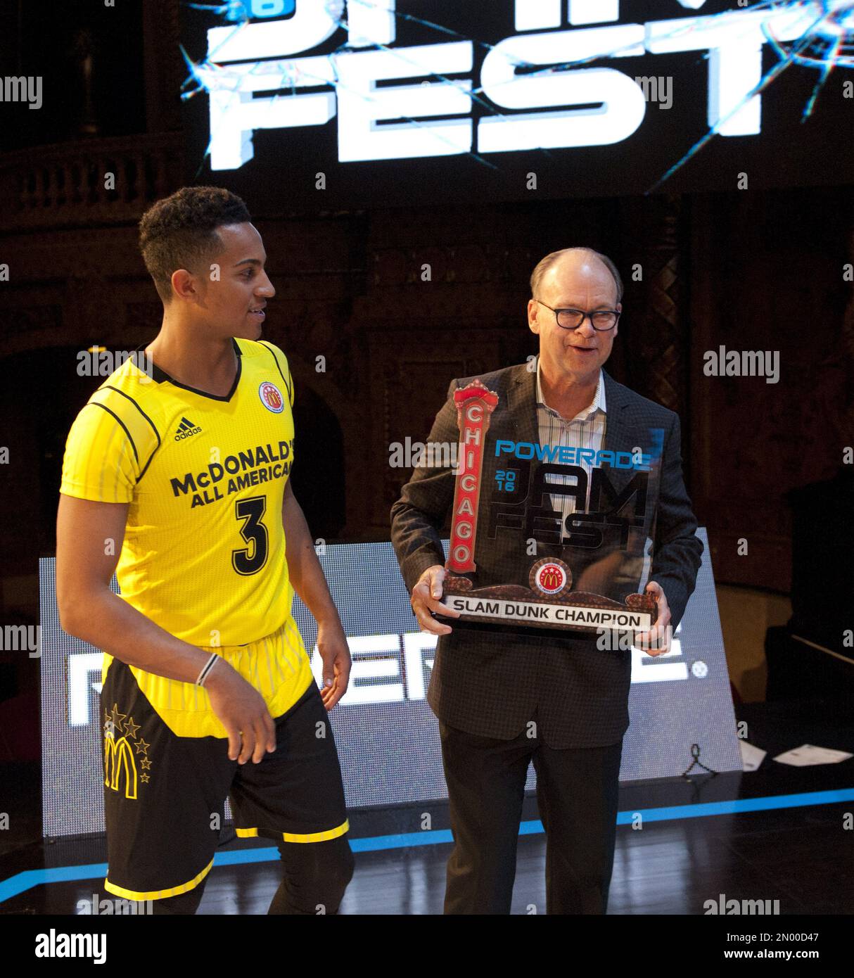 Frank Jackson, left, from Highland, Utah, receives a trophy from Mike ...