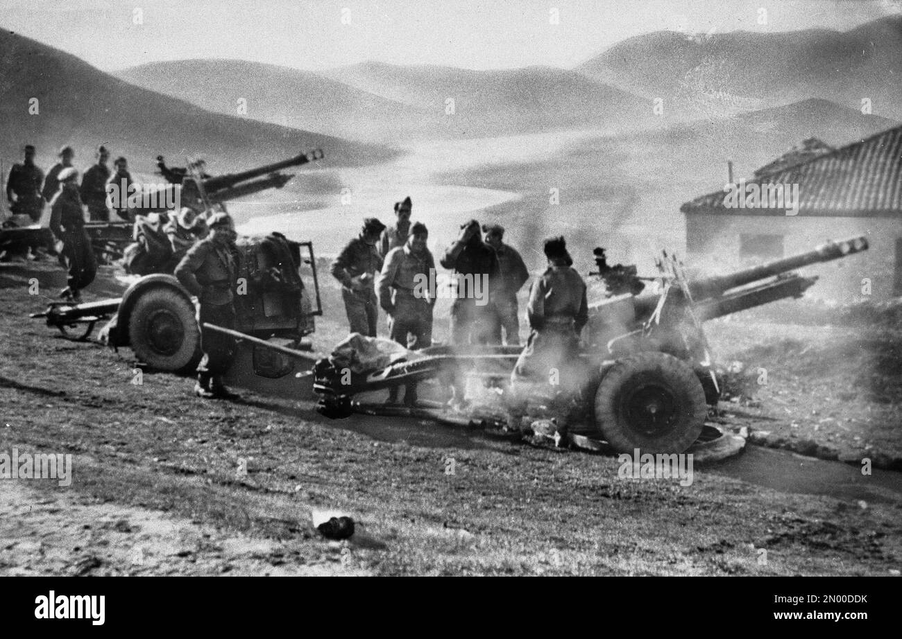 Greek artillerymen of the 43rd Division fire on guerrilla positions ...