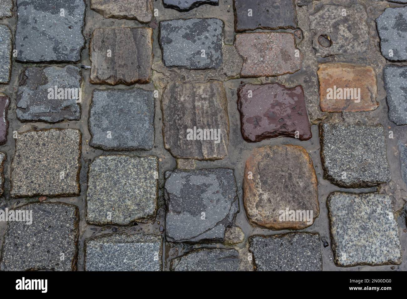 Granite dirty paving stones in the city. Road from paving stones for ...