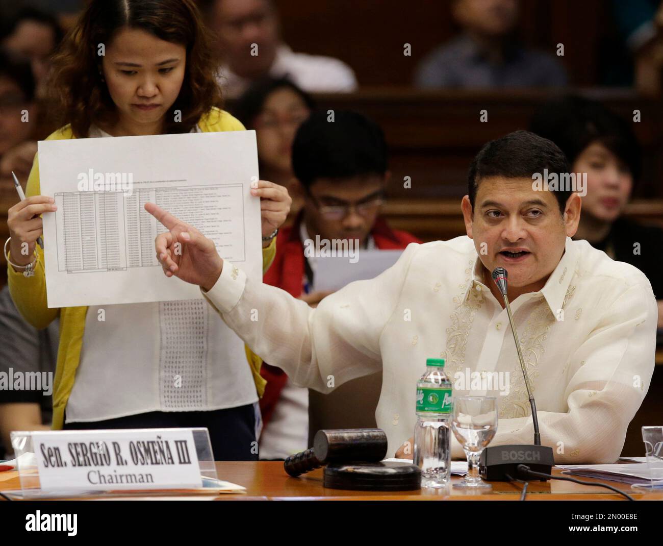 Philippine Sen. Teofisto Guingona III gestures as he shows a document ...