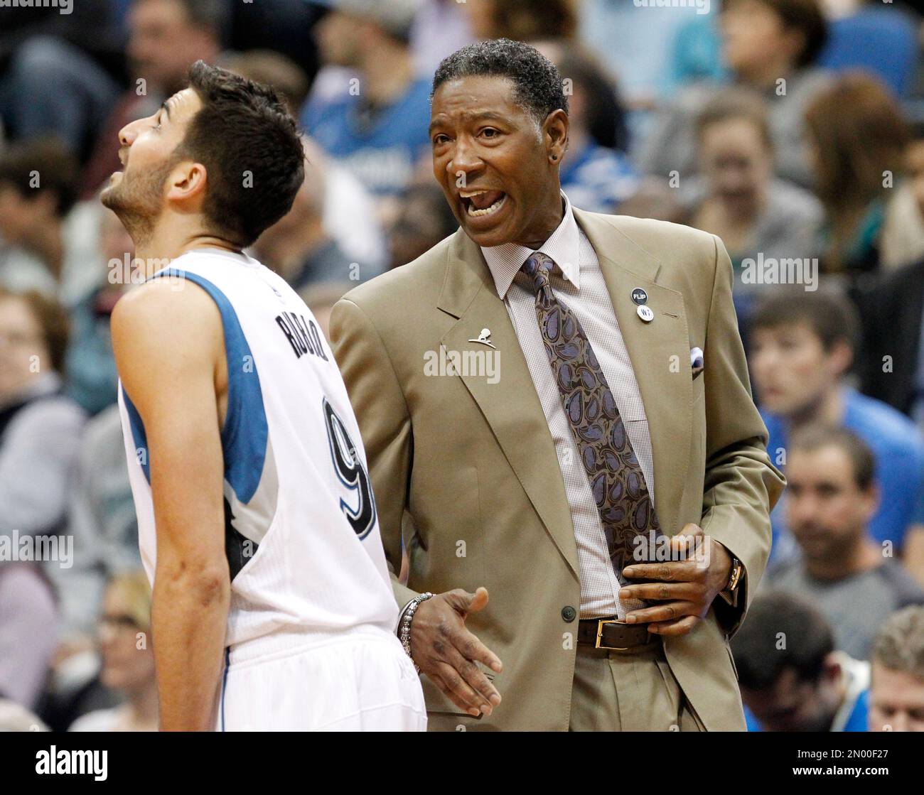 Minnesota Timberwolves head coach Sam Mitchell, right, talks with guard ...