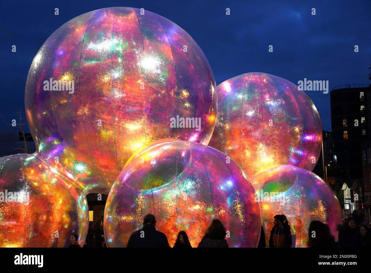 Visitors observe Evanescent, an immersive light and sound installation ...