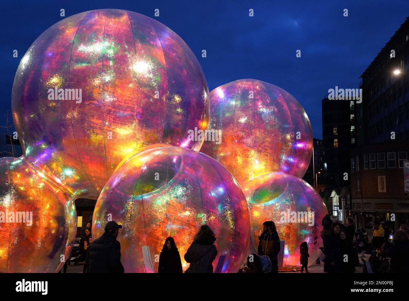 Visitors observe Evanescent, an immersive light and sound installation ...