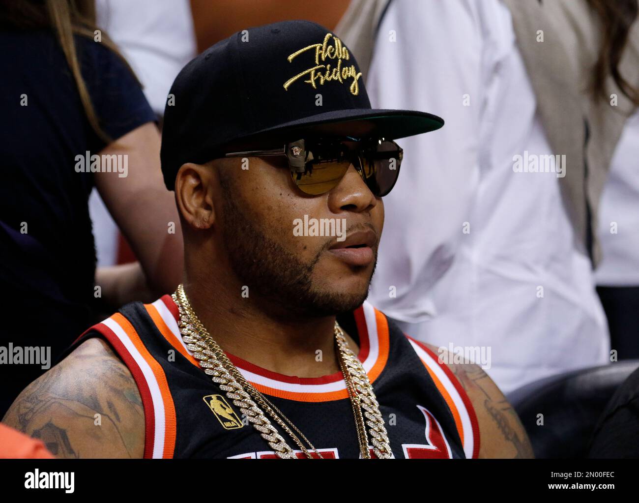 Hip hop recording artist Flo Rida sits courtside before the Miami Heat ...