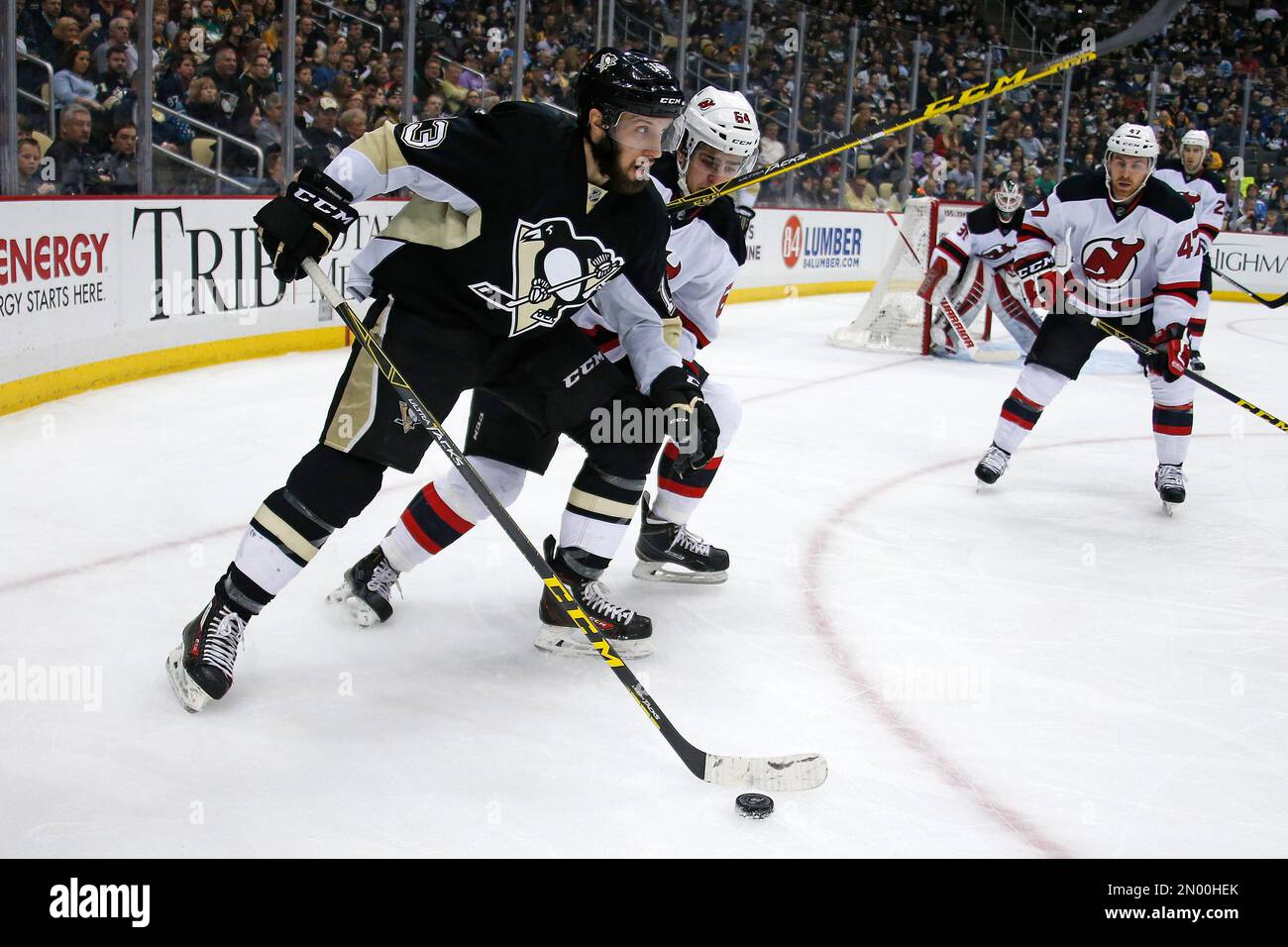 Pittsburgh Penguins' Nick Bonino (13) battles New Jersey Devils center ...