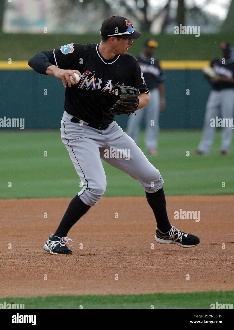 Miami Marlins infielder Don Kelly fields a ground ball during infield ...