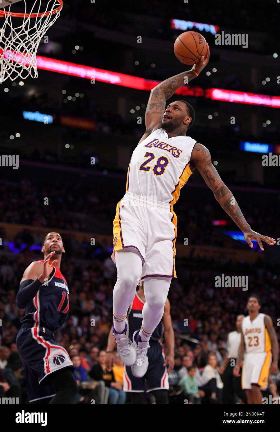Los Angeles Lakers center Tarik Black, right, tries to dunk and misses as Washington Wizards ...