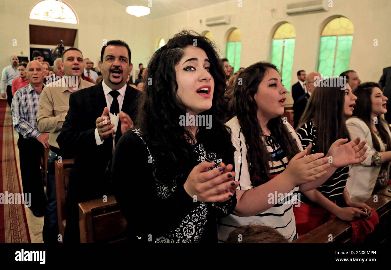 Iraqi Christians pray during Easter Mass at Baghdad's Christian Union ...