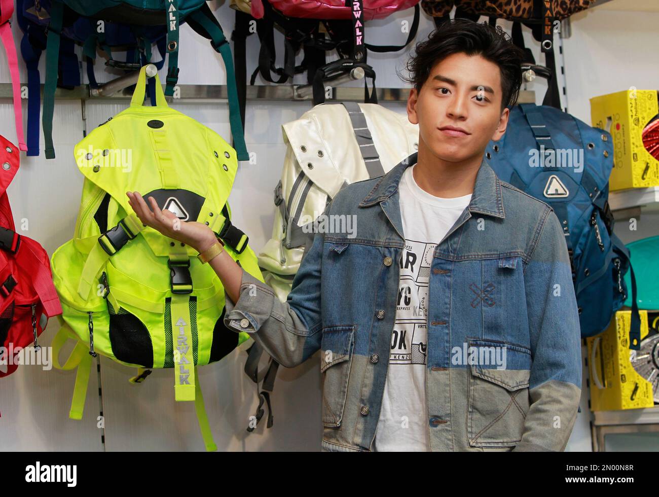 Taiwanese actor Darren Wang poses for photographers during a ...