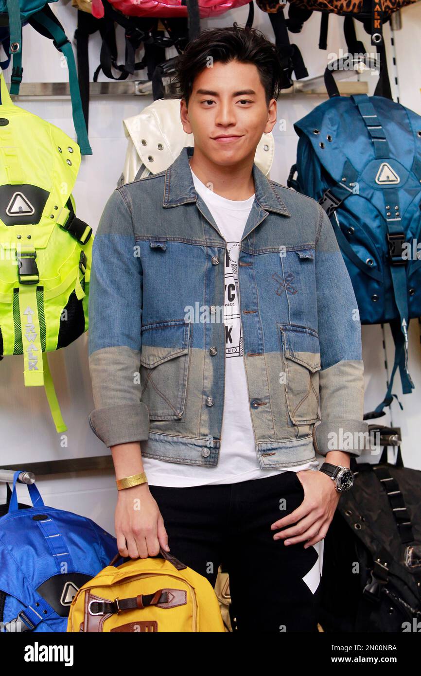 Taiwanese actor Darren Wang poses for photographers during a ...