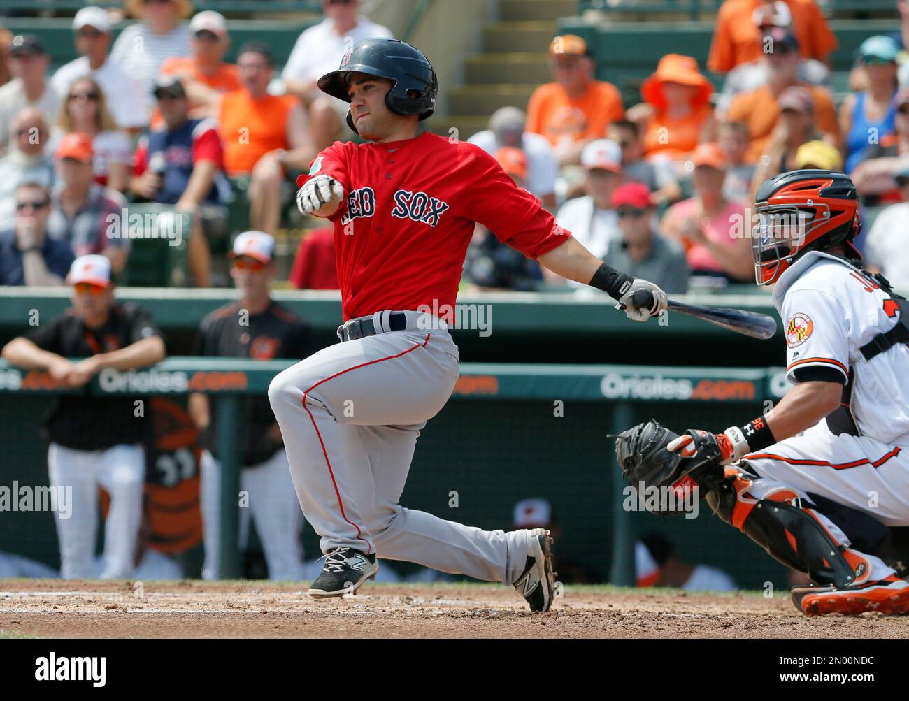 Boston Red Sox' Mike Miller follows through on a swing as Baltimore ...