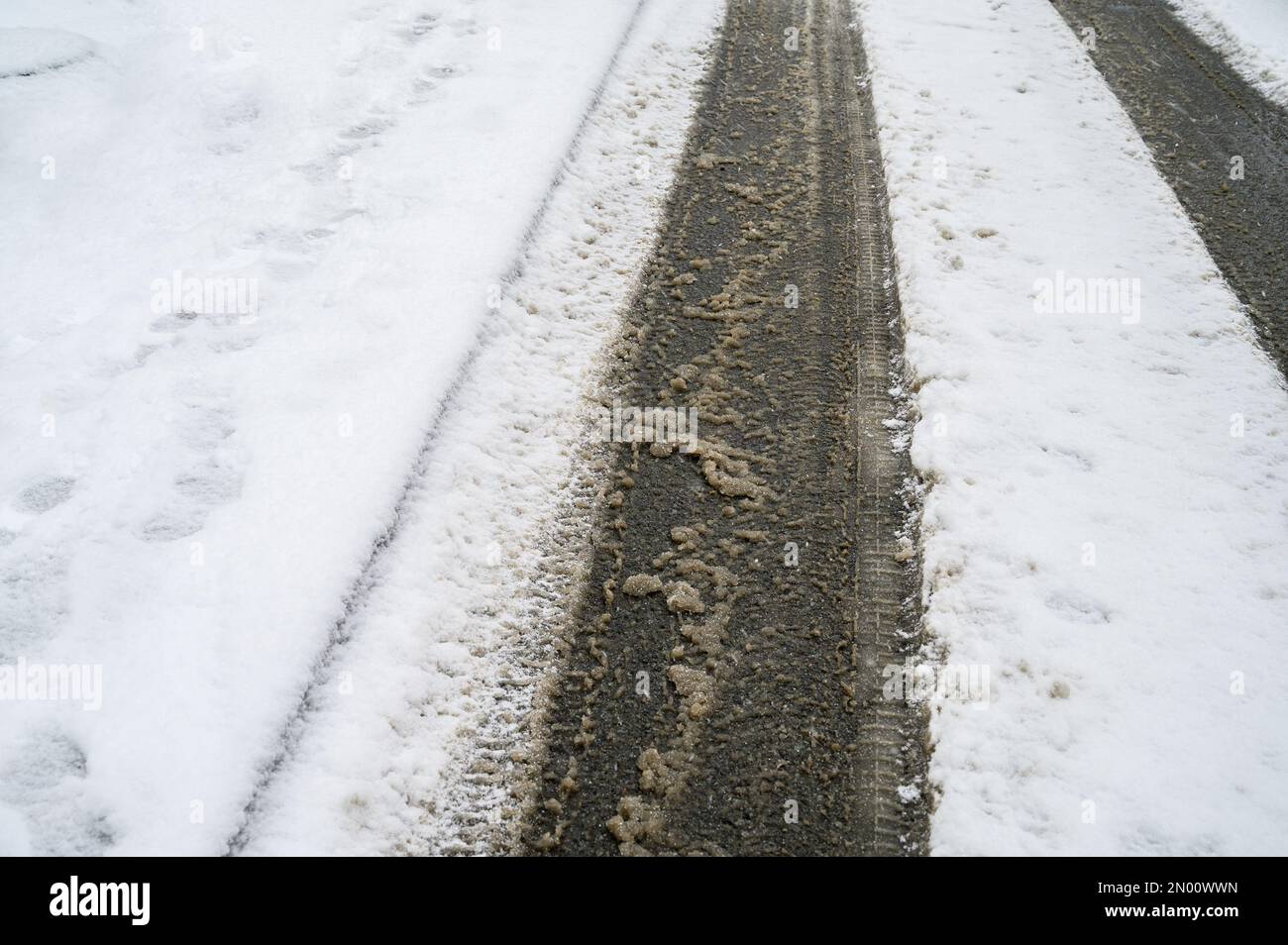 Road covered with snow and mud in winter Stock Photo - Alamy