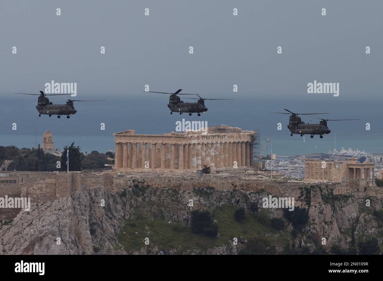 Chinook helicopters fly over Parthenon temple on the ancient Acropolis ...