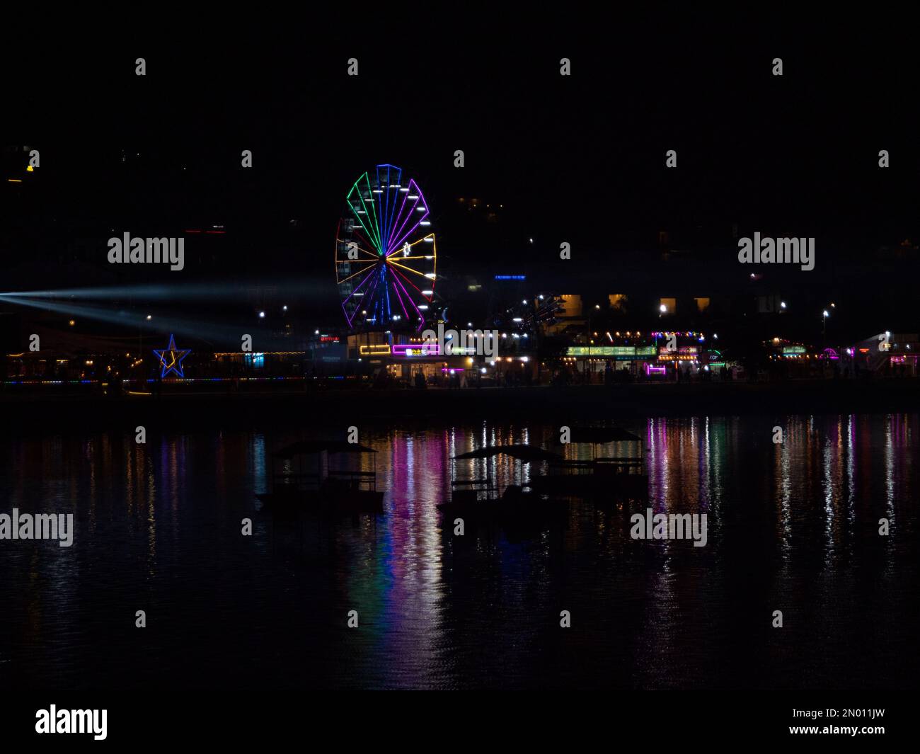 Pokhara fun fare park at night from opposite side of the lake Stock ...