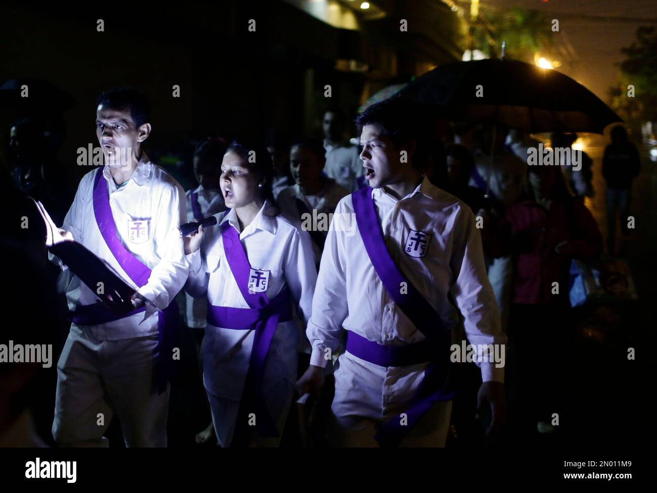 A group of "estacioneros" sing during a procession celebrating Catholic ...