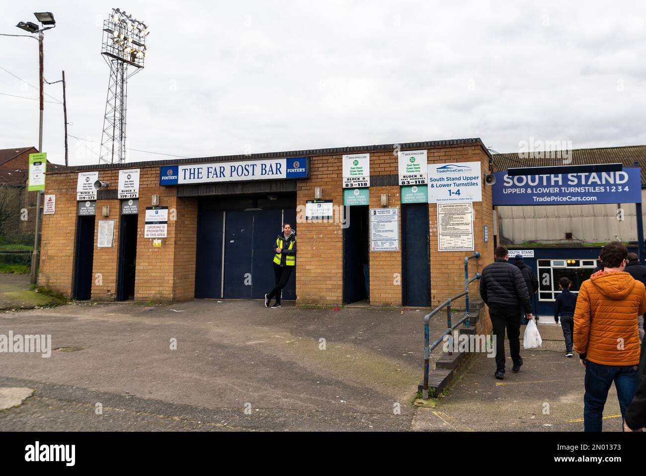 Football supporters entering a turnstile at Roots Hall football ground ...