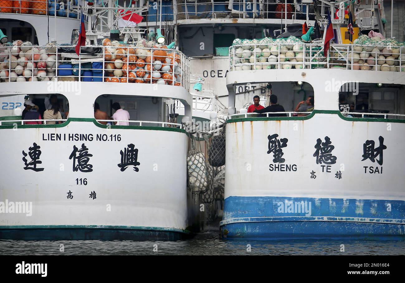 People wait on board two tuna longliners, Lien I Hsing No. 116 and ...