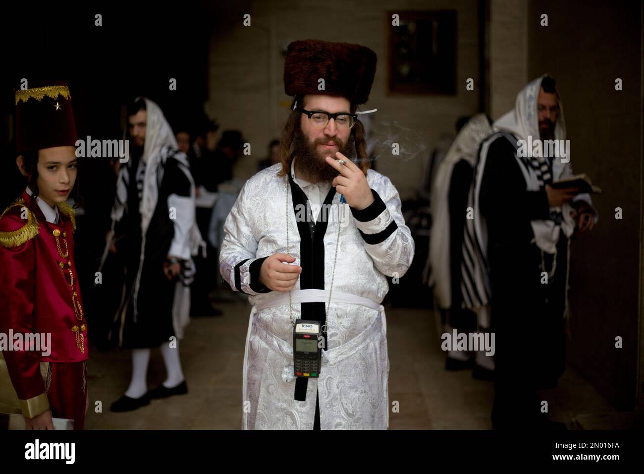 A Jewish Orthodox man of the Tzanz Hasidic dynasty community smokes a ...