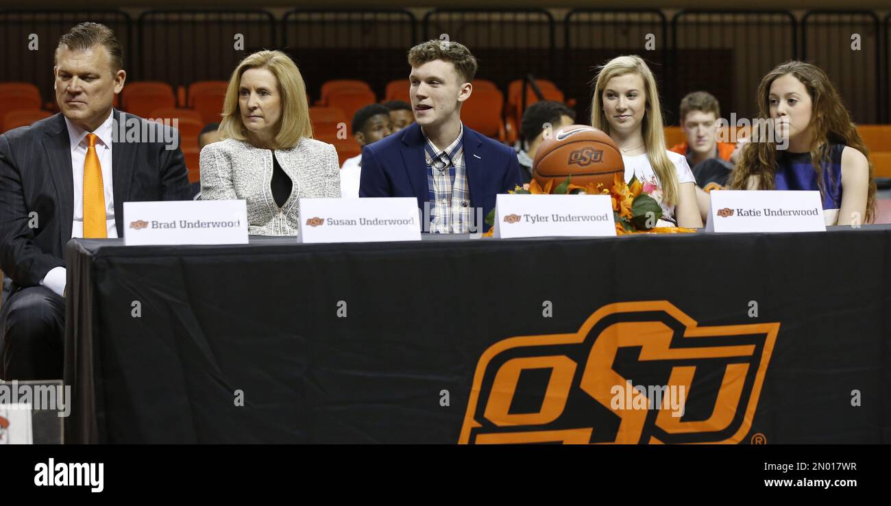 Brad Underwood, left, is pictured with his family at a news conference ...