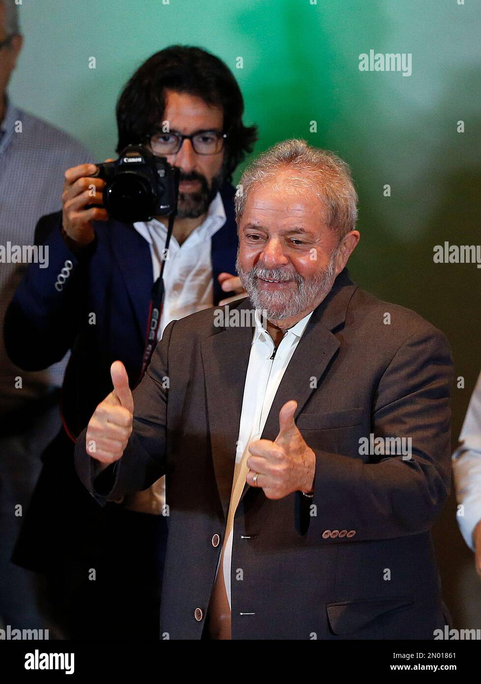Brazil's former President Luiz Inacio Lula da Silva gives the thumbs up ...