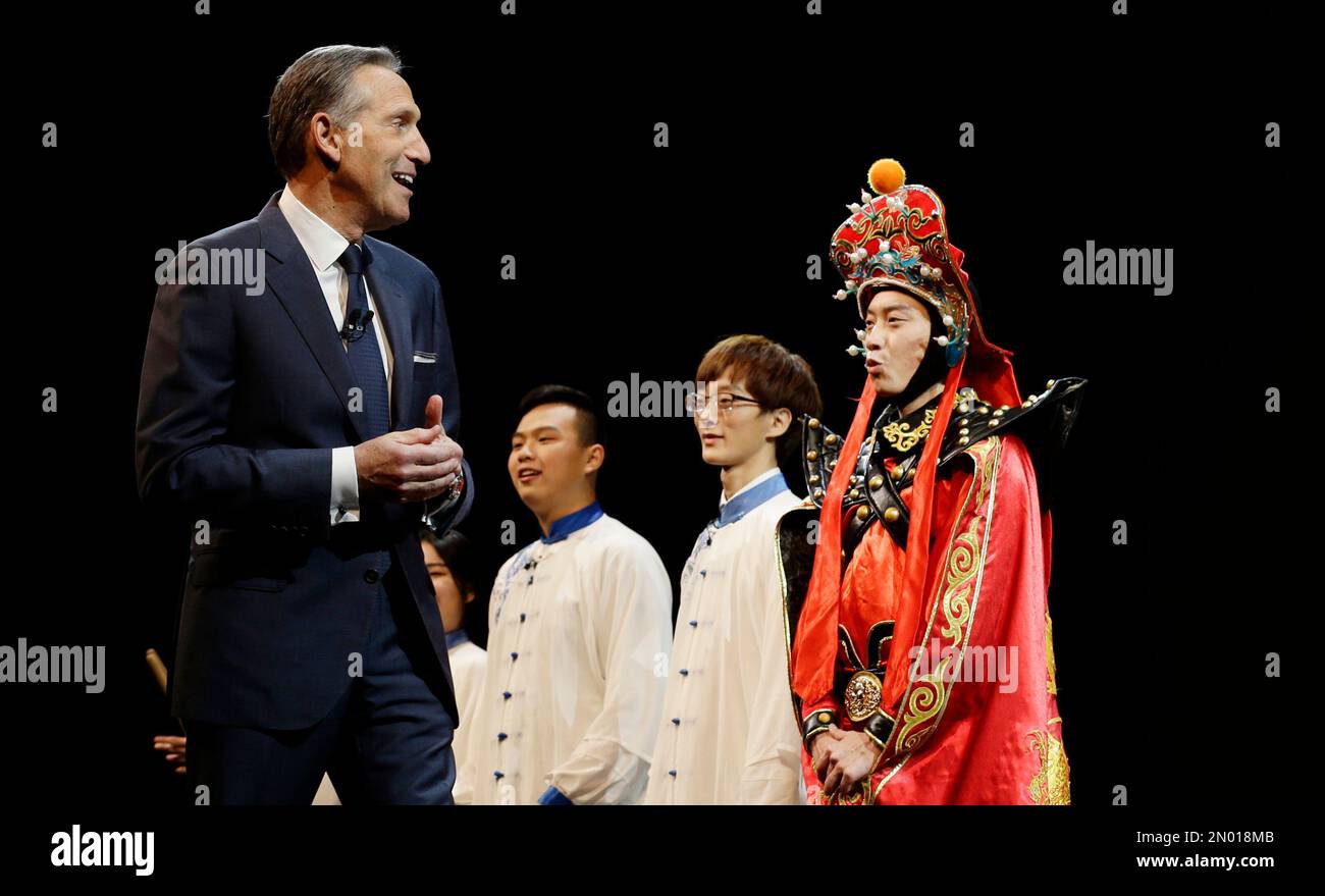 Starbucks CEO Howard Schultz, left, greets Starbucks workers from China ... Starbucks CEO Howard Schultz, left, greets Starbucks workers from China ...