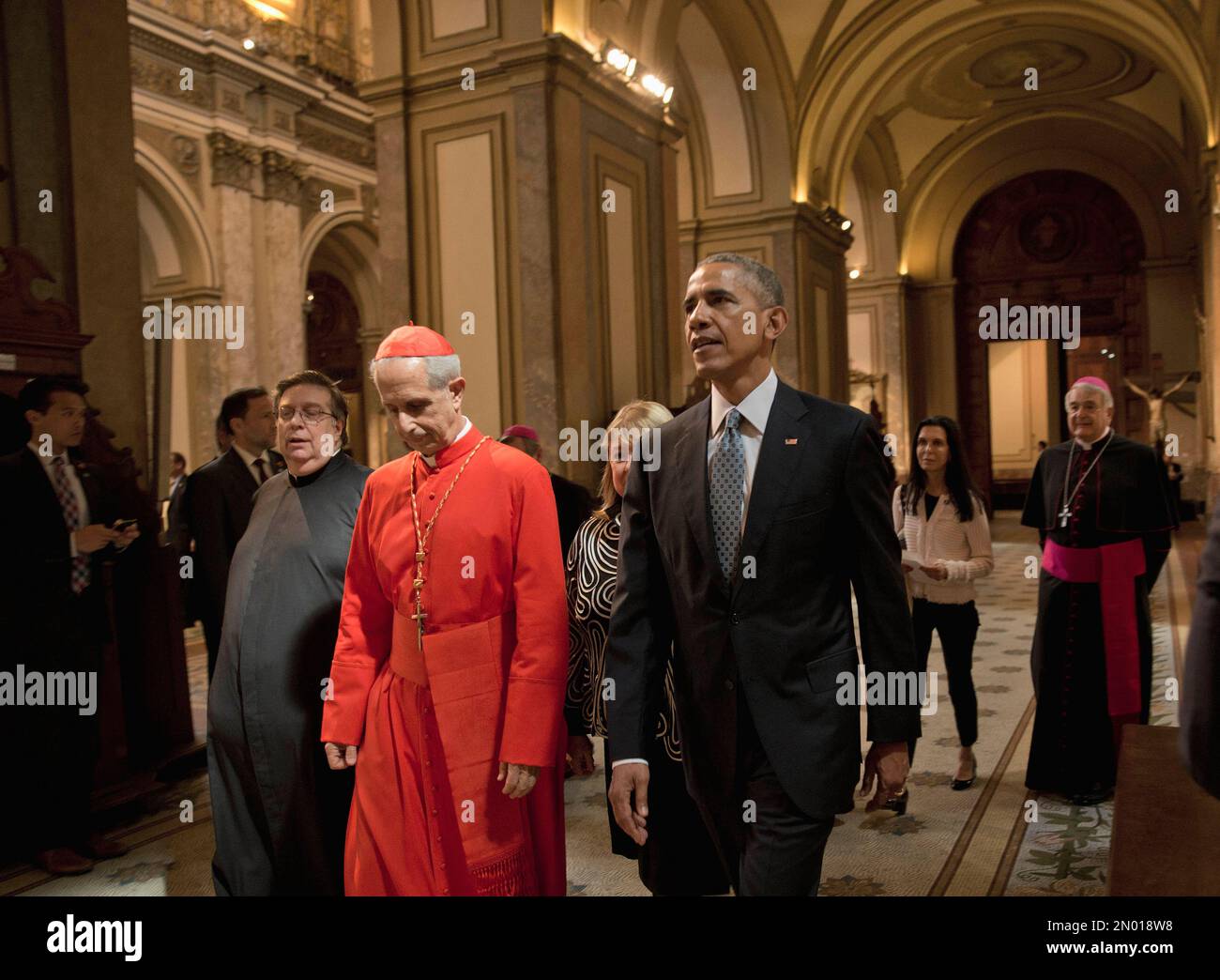 President Barack Obama walks with Cardinal Mario Aurelio Poli as he ...