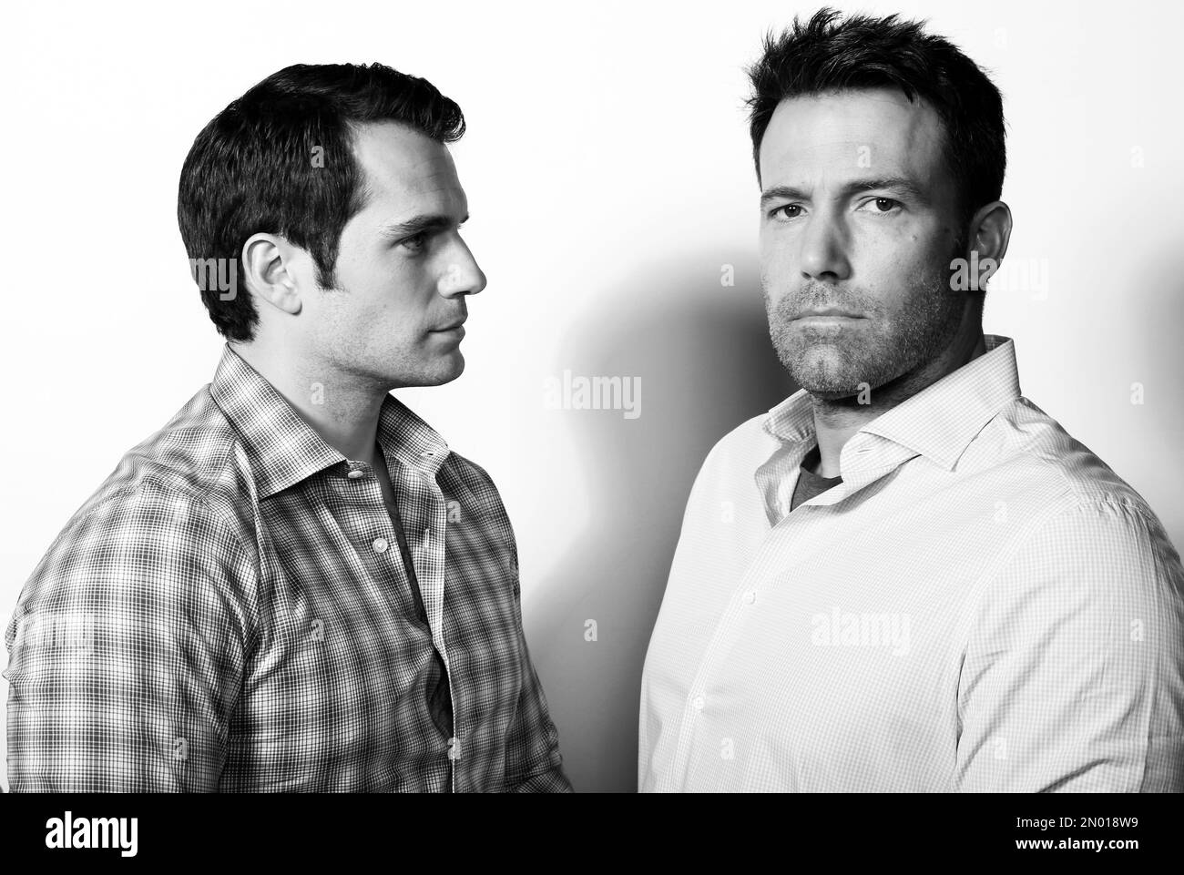 In this March 18, 2016 photo, Henry Cavill, left, and Ben Affleck pose ...