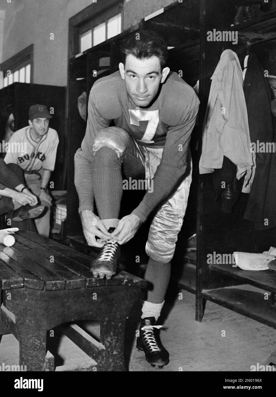 Clarence "Ace" Parker of the Brooklyn Dodgers football team, prepares ...