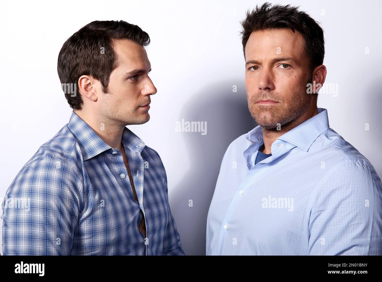In this March 18, 2016 photo, Henry Cavill, left, and Ben Affleck pose ...