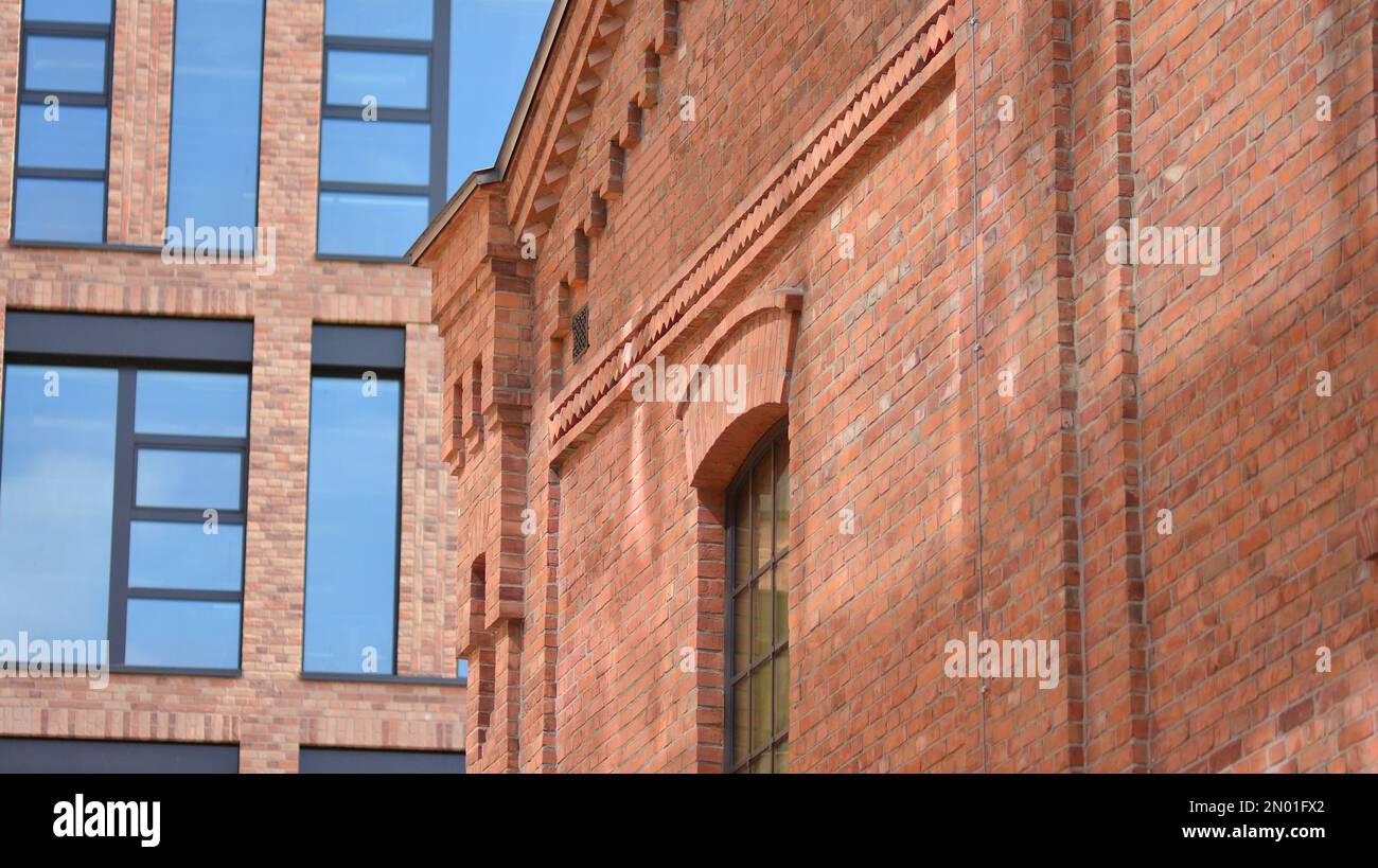 Modern brick and glass facade of the office building. A contrasting ...