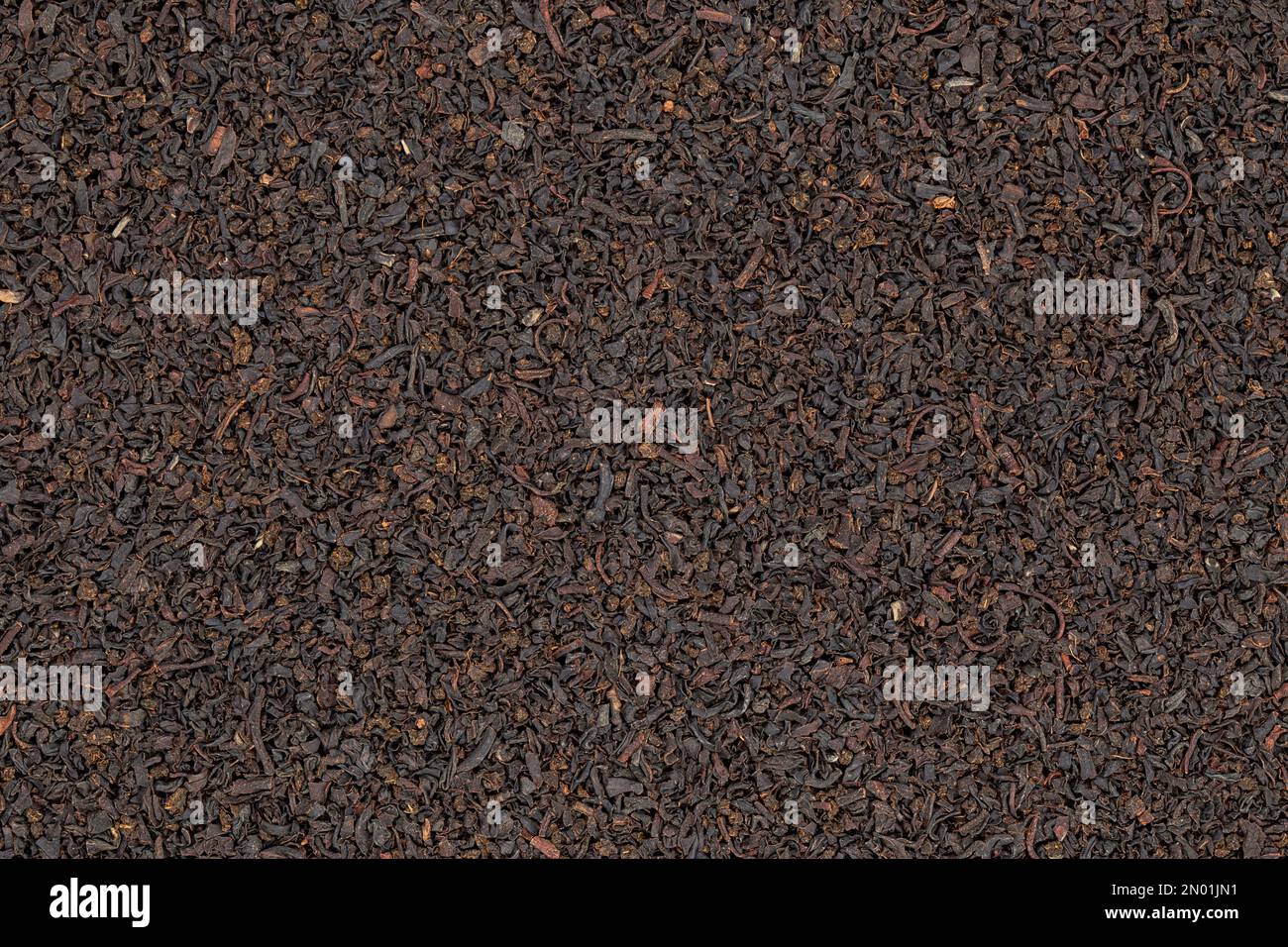 Black tea background. Top view. Dry black tea leaves Stock Photo - Alamy