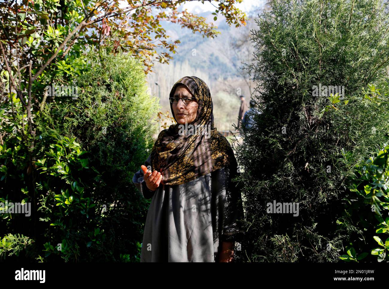 A Kashmiri Shiite Muslim woman prays at the shrine of Peer Syed Mehndi ...