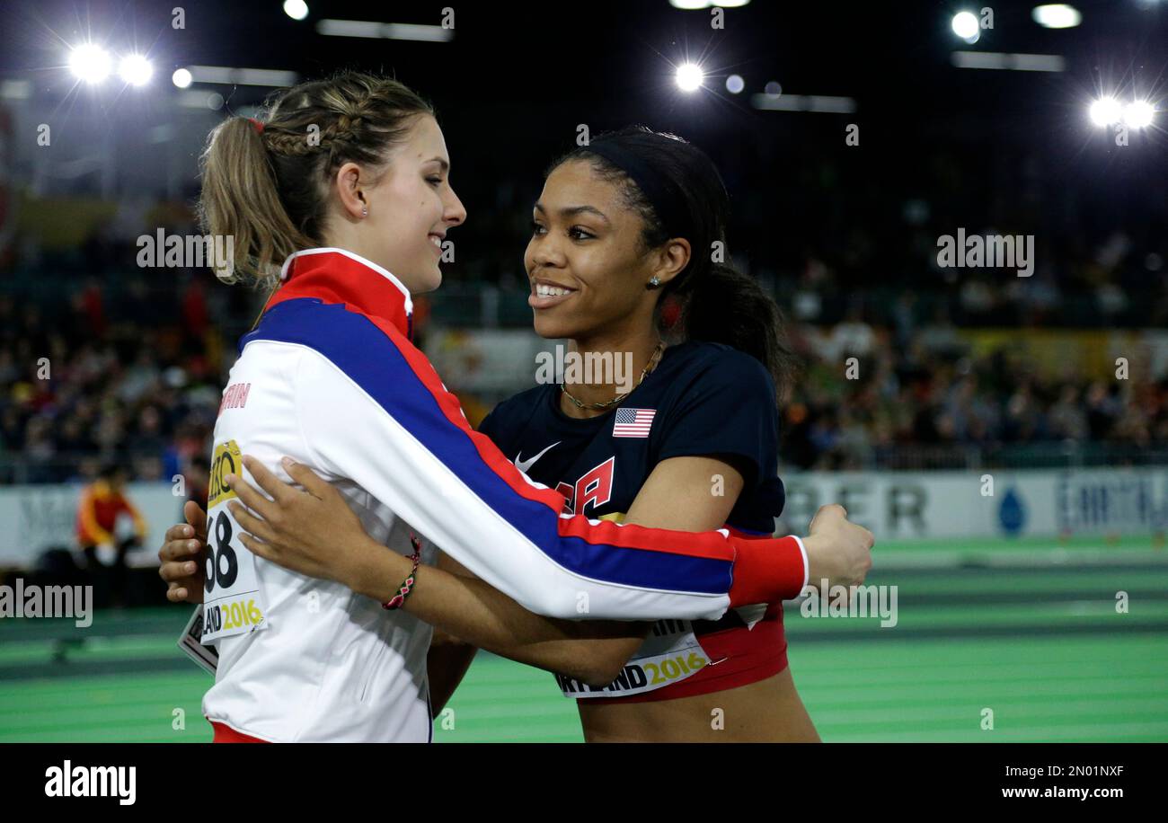 United States' Vashti Cunningham, right, is hugged by Britain's Isobel ...
