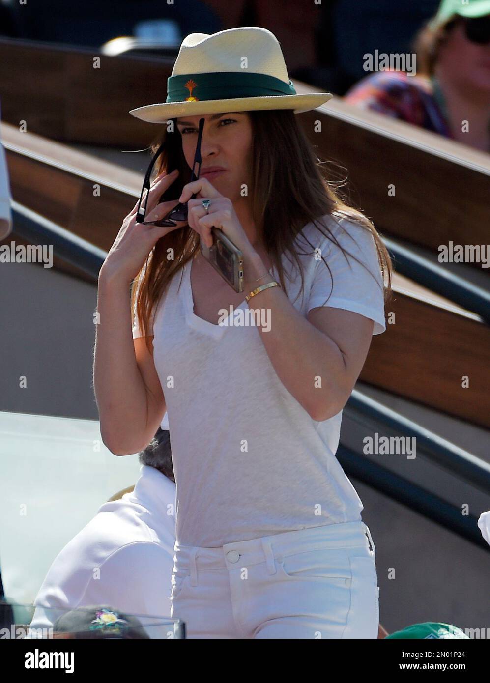 Actress Hilary Swank watches Novak Djokovic play Milos Raonic in a ...
