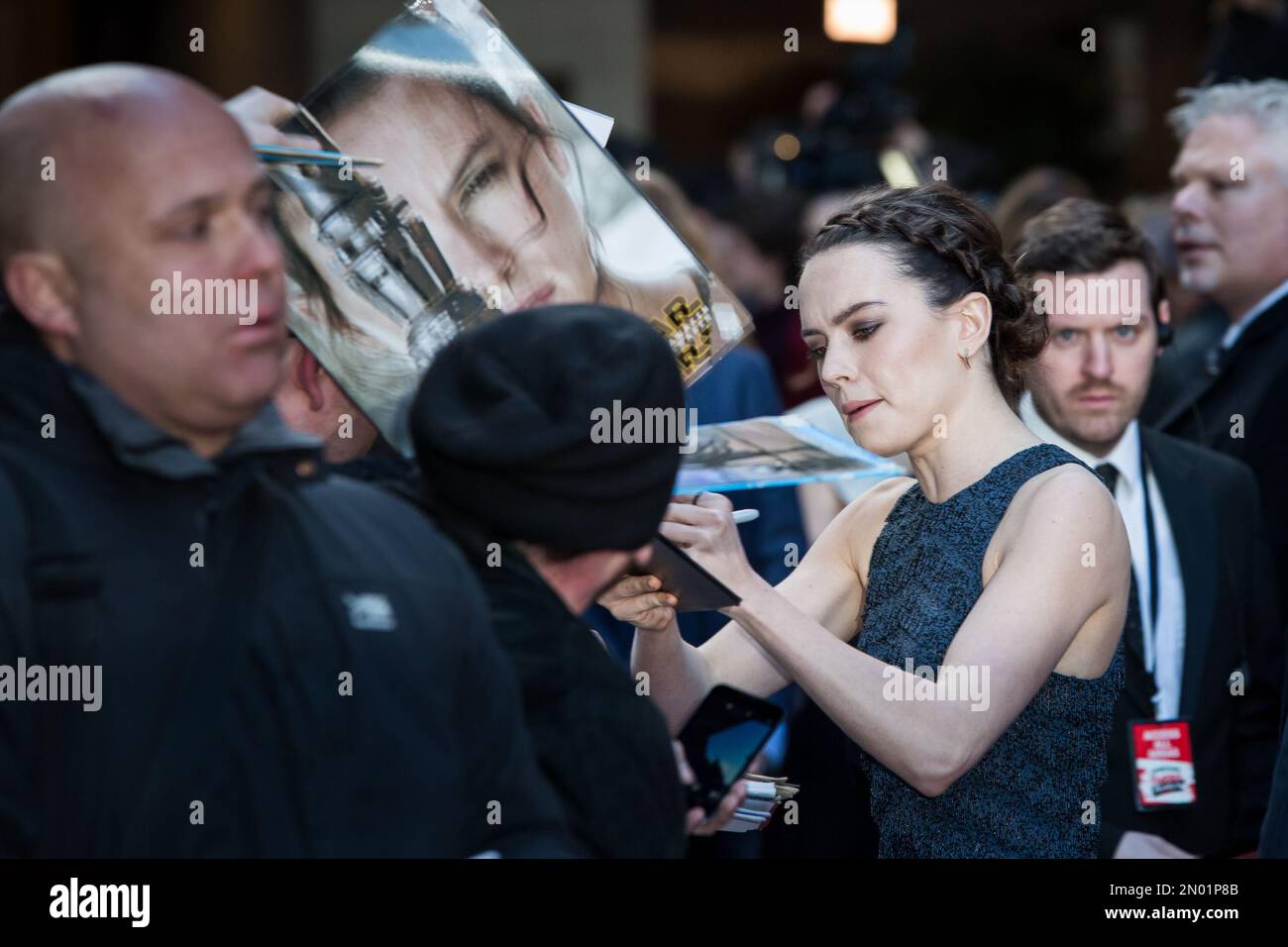 Daisy Ridley signs autographs upon arrival at the Empire Film Awards in ...