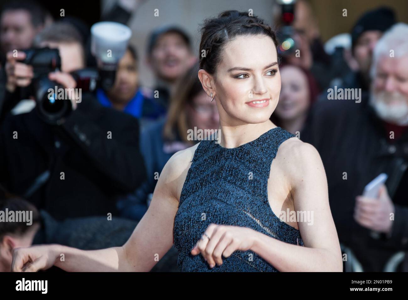 Daisy Ridley poses for photographers upon arrival at the Empire Film ...