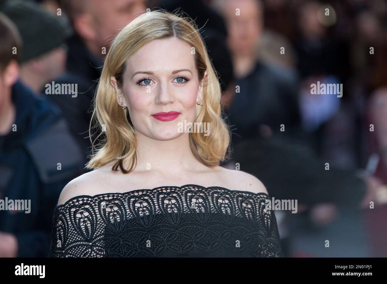 Cara Theobold poses for photographers upon arrival at the Empire Film ...