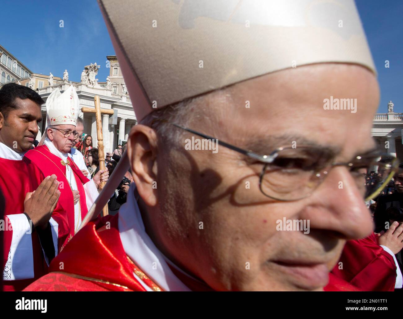Pope Francis walks in procession as he celebrates the Palm Sunday Mass ...