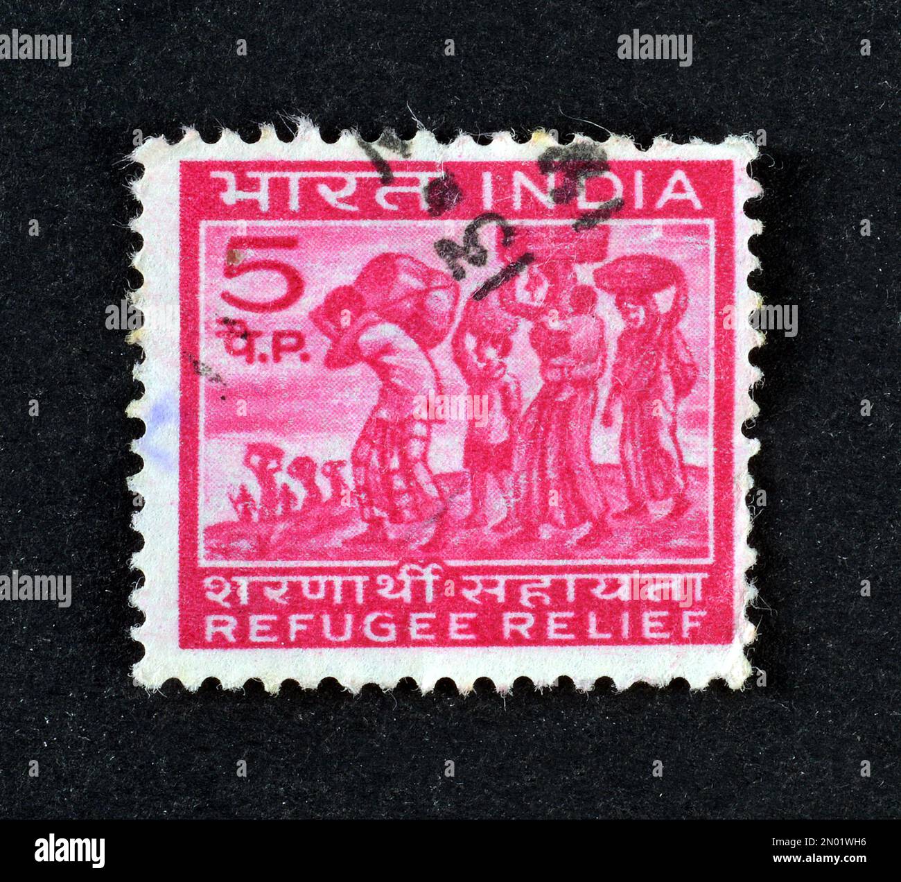 Cancelled postage stamp printed by India, that shows Refugees ...