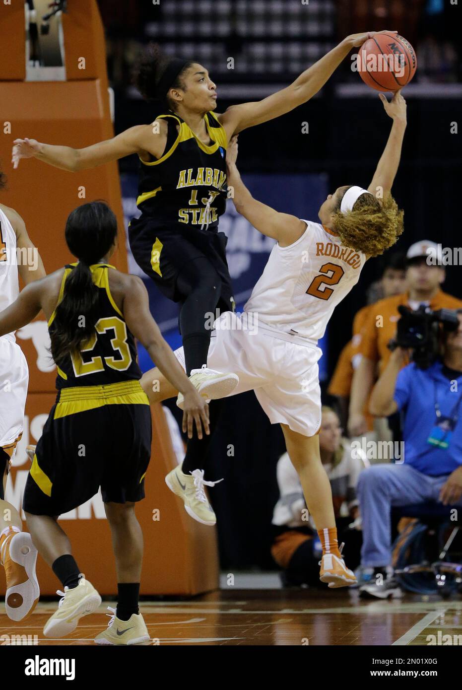 Texas guard Celina Rodrigo (2) is fouled by Alabama State defender ...