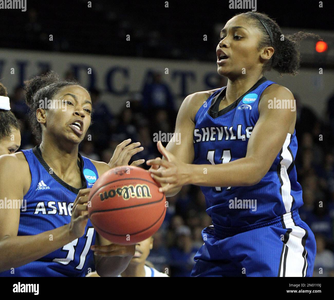 UNC Asheville's KJ Weaver, left, and Khaila Webb struggle with a ...